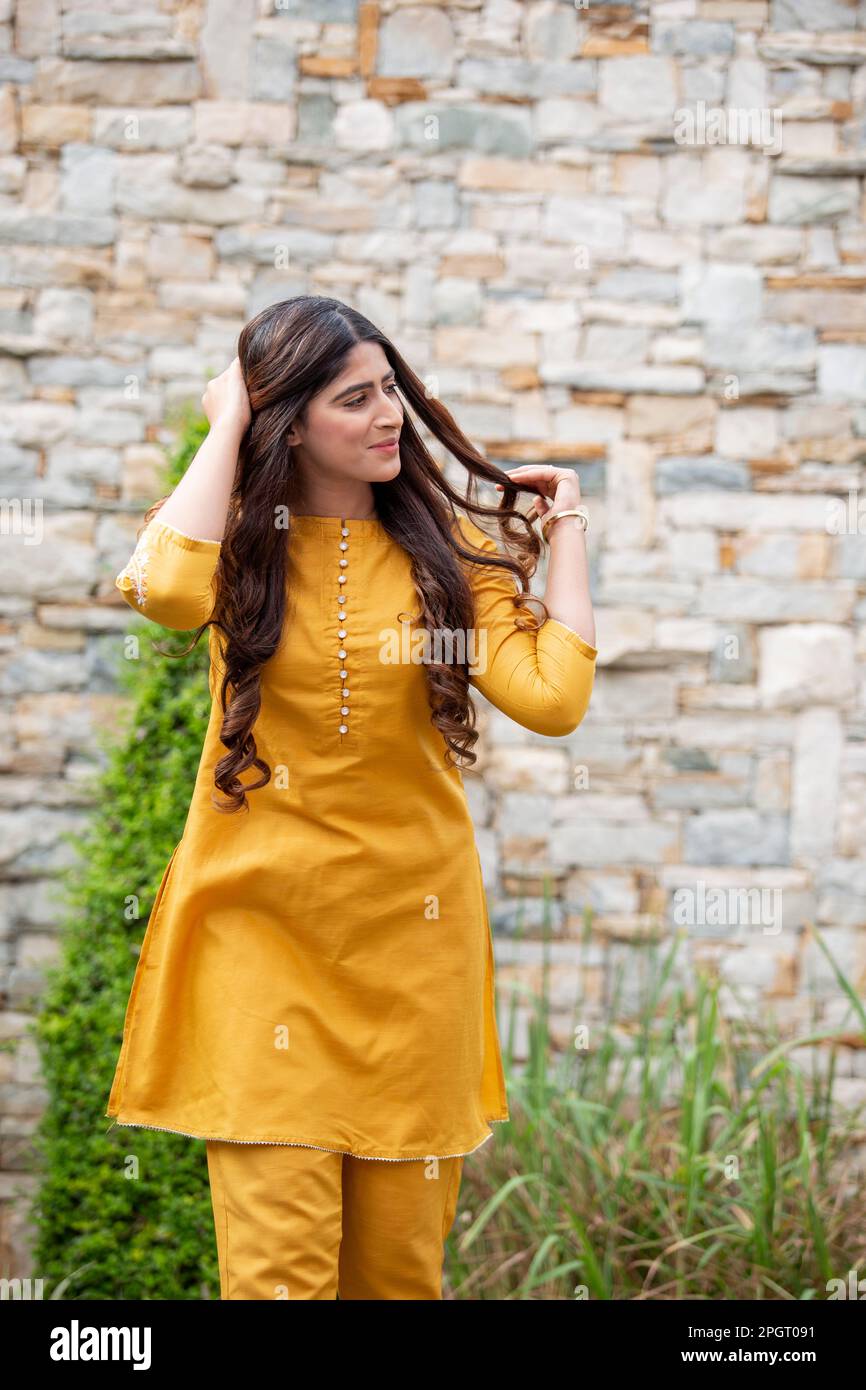 Female model posing outdoors wearing summer dress Indian Pakistani ...