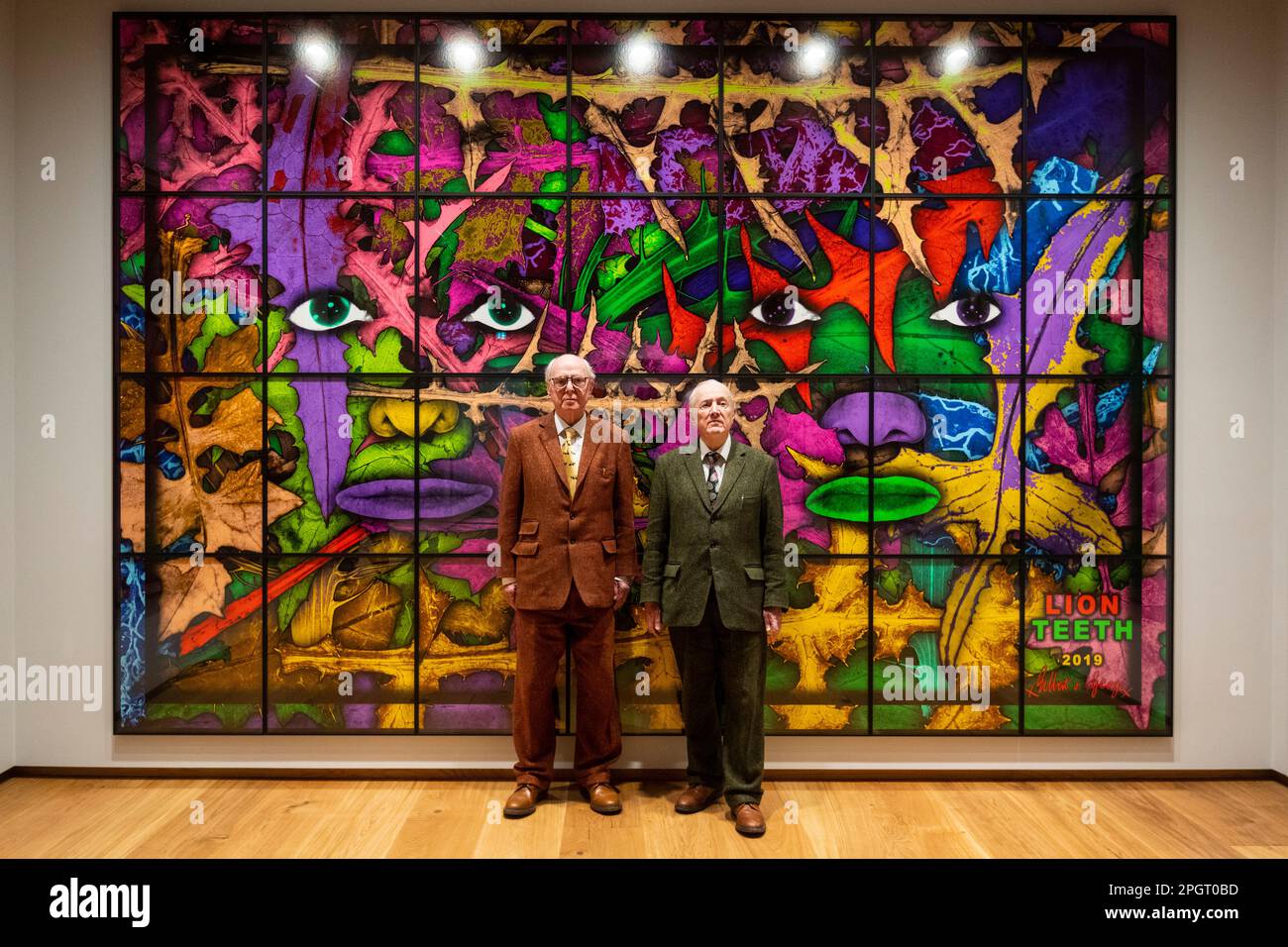 London, UK. 24 March 2023. Artists Gilbert & George, in front of 'Lion ...