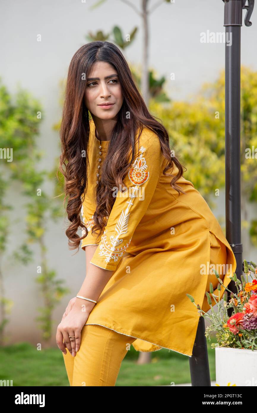 Female model posing outdoors wearing summer dress Indian Pakistani ...