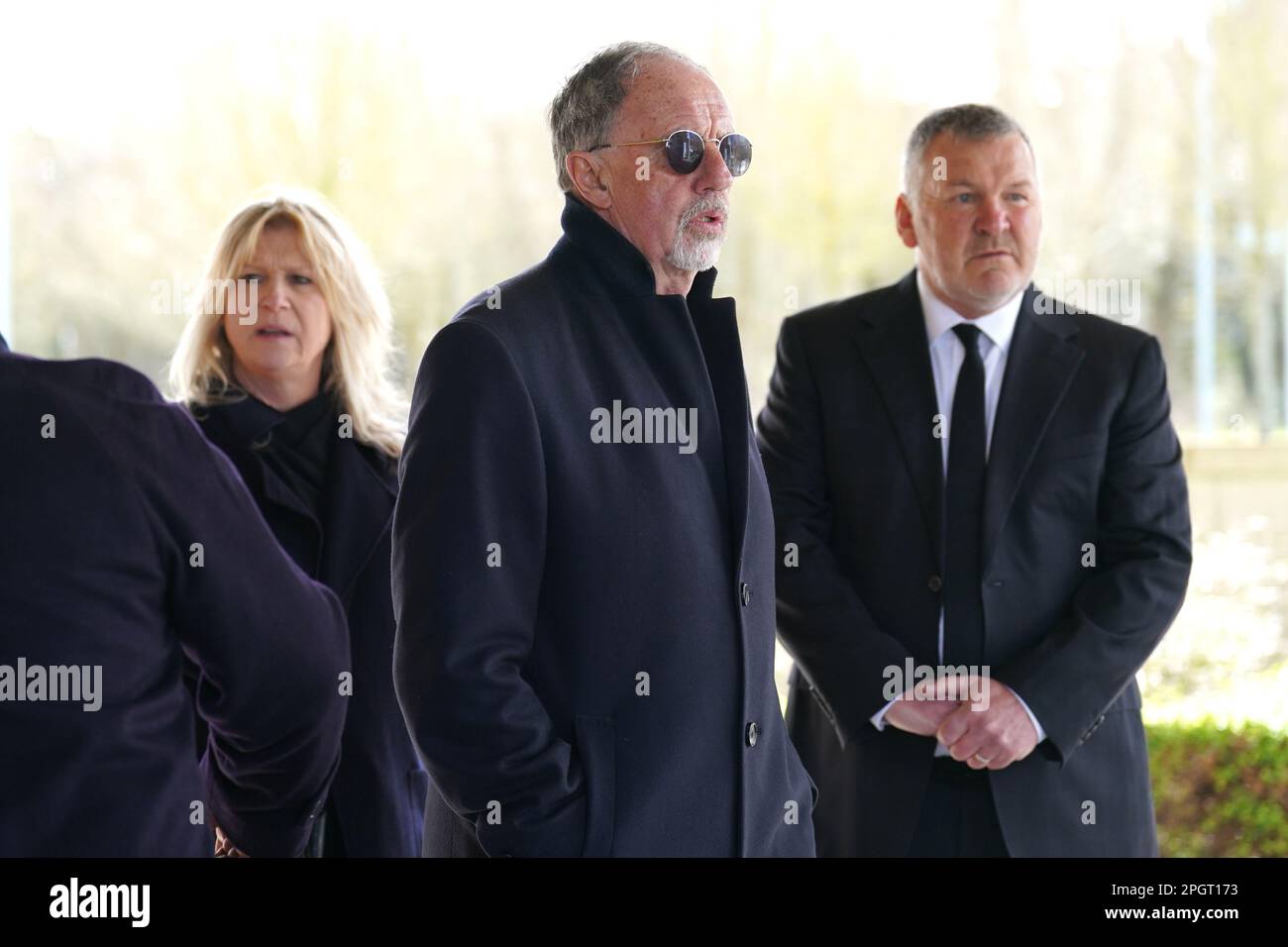 Mark Lawrenson (centre) and Ray Stubbs arrive ahead of a funeral ...
