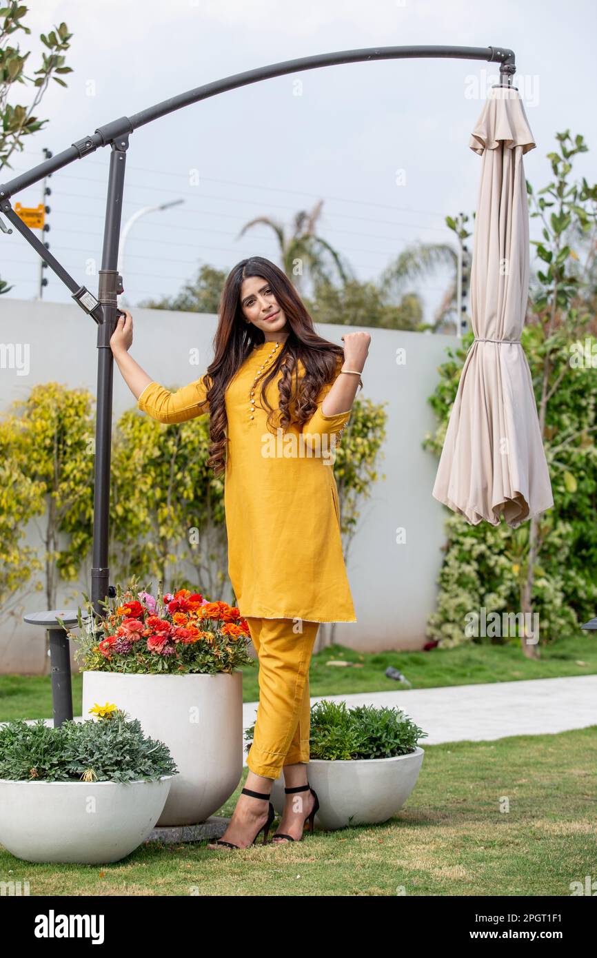 Female model posing outdoors wearing summer dress Indian Pakistani ...