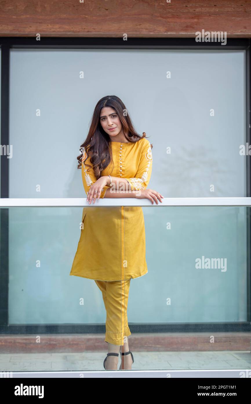 Female model posing outdoors wearing summer dress Indian Pakistani ...
