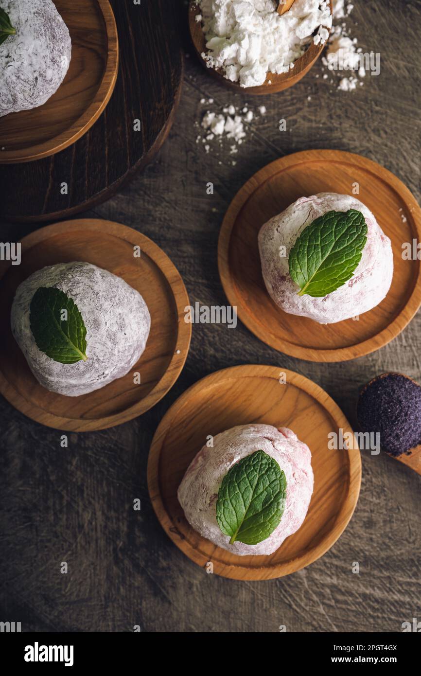 Japanese mochi or rice cake filled with red bean and strawberry, mint ...