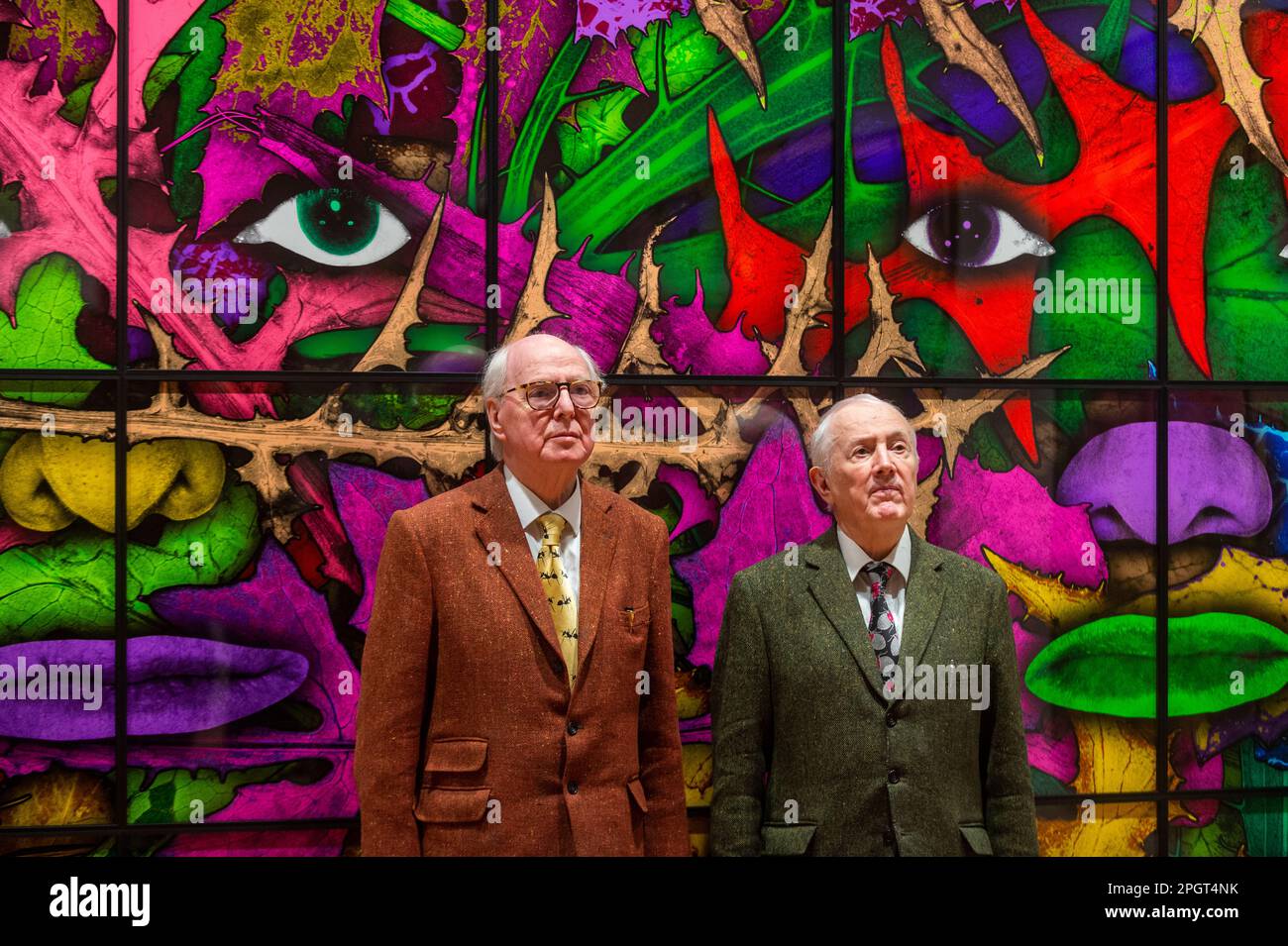 London, UK. 24 March 2023. Artists Gilbert & George, in front of 'Lion ...
