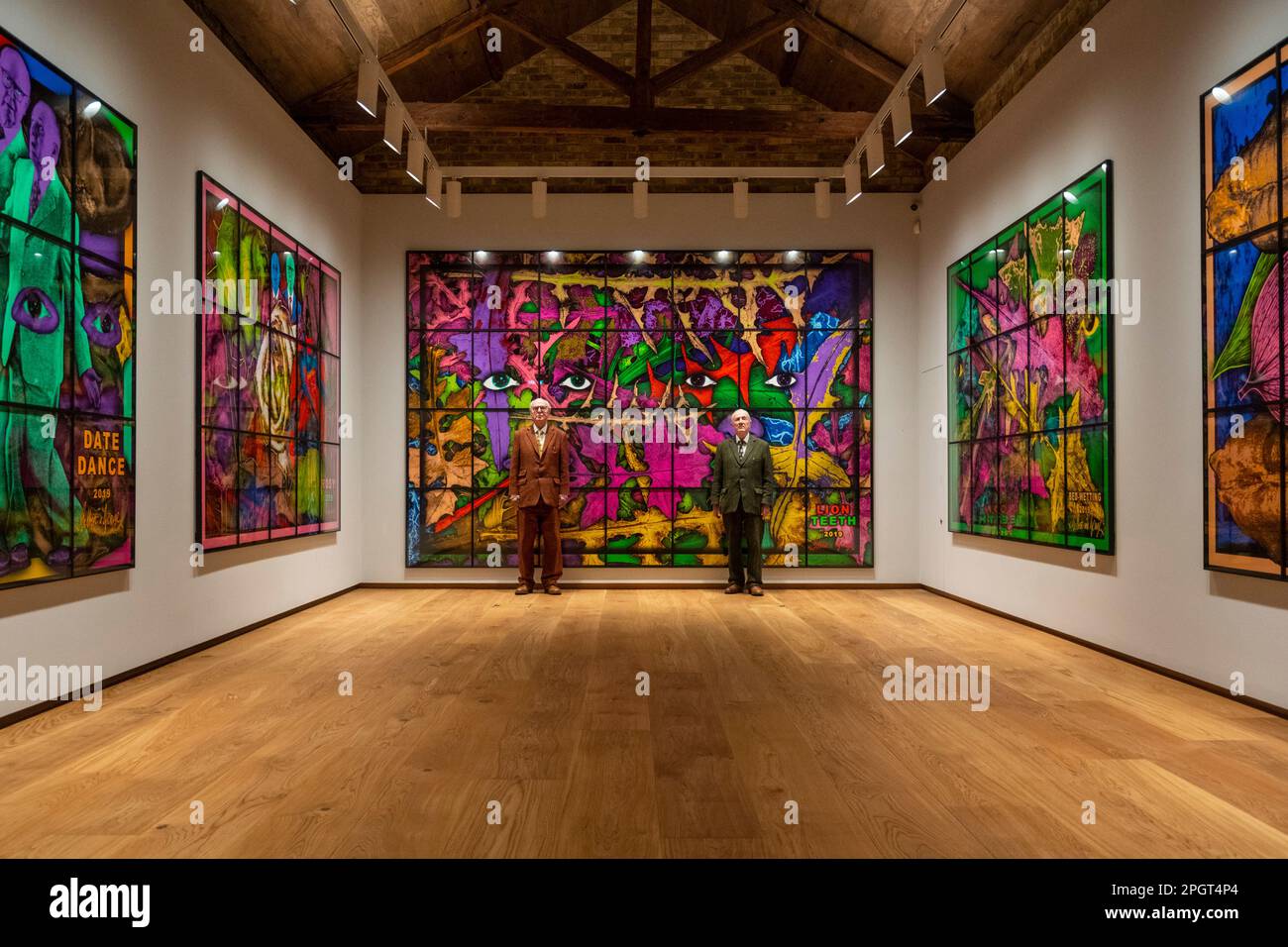 London, UK. 24 March 2023. Artists Gilbert & George, in front of 'Lion ...