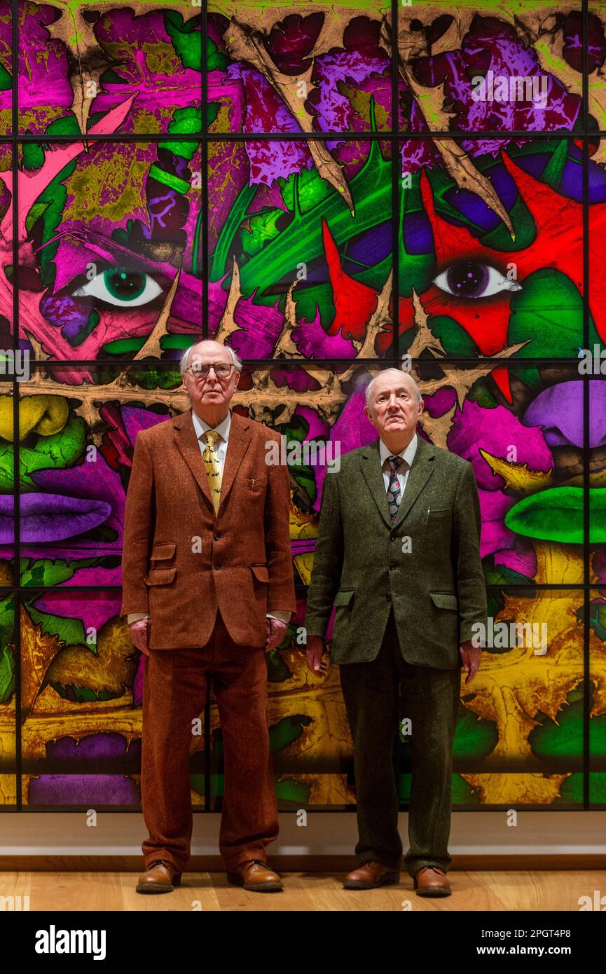 London, UK. 24 March 2023. Artists Gilbert & George, in front of 'Lion ...