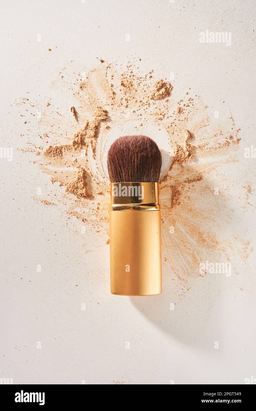 Soft cosmetic brush, with shining sparkling powder on the bristles.The ...