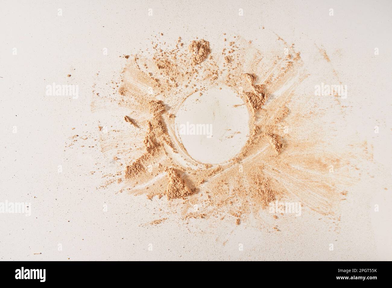 A neutral-colored face powder scattered on the surface in the form of a ...