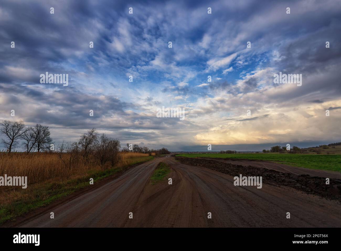 Spring country road after rain, countryside. Clouds and sky Stock Photo ...