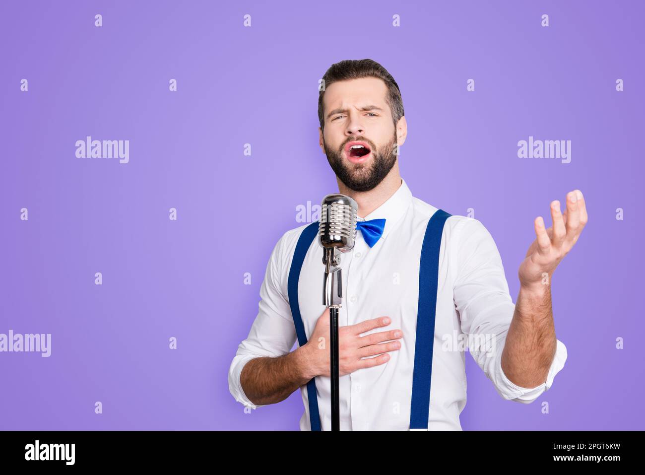 Portrait of talented attractive singer with bristle stubble in elegant ...