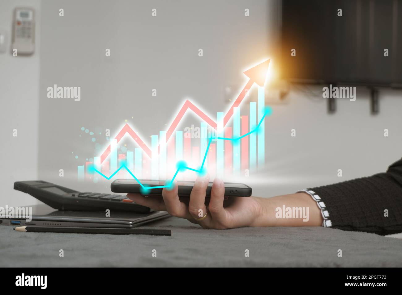 business growth plan with virtual hologram chart Calculate earnings and ...