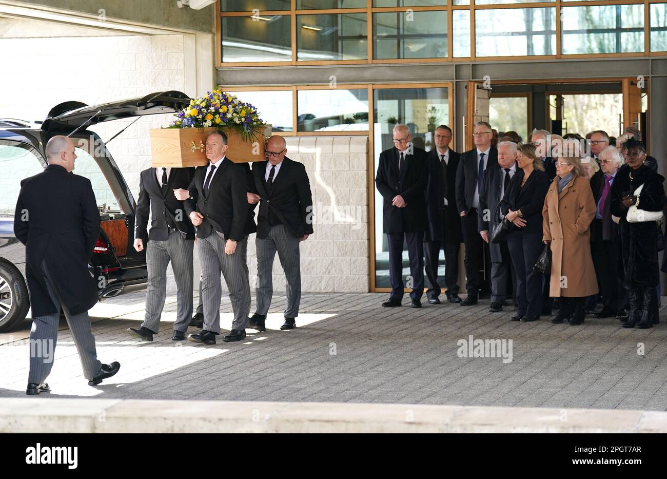 The coffin of John Motson is carried into Crownhill Crematorium, Milton ...