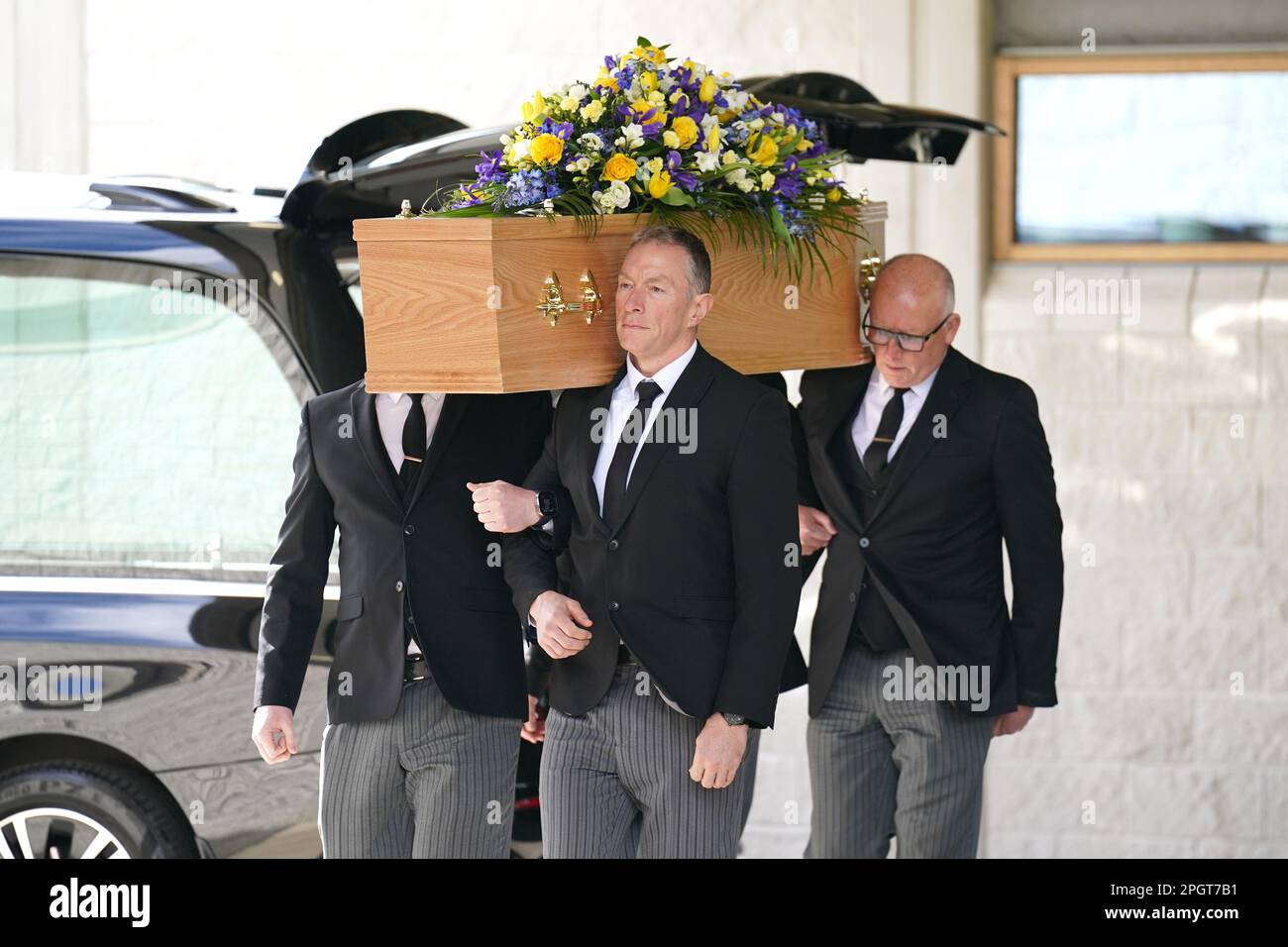 The coffin of John Motson is carried into Crownhill Crematorium, Milton ...