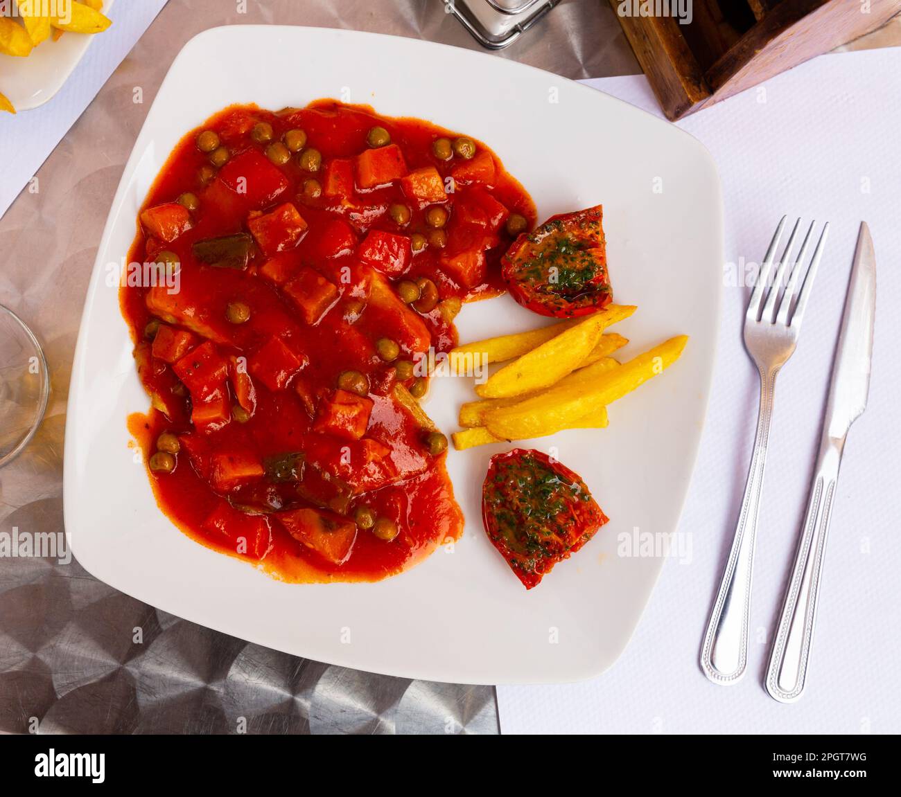 Tilapia with vegetable stew, french fries and sun-dried tomato Stock ...