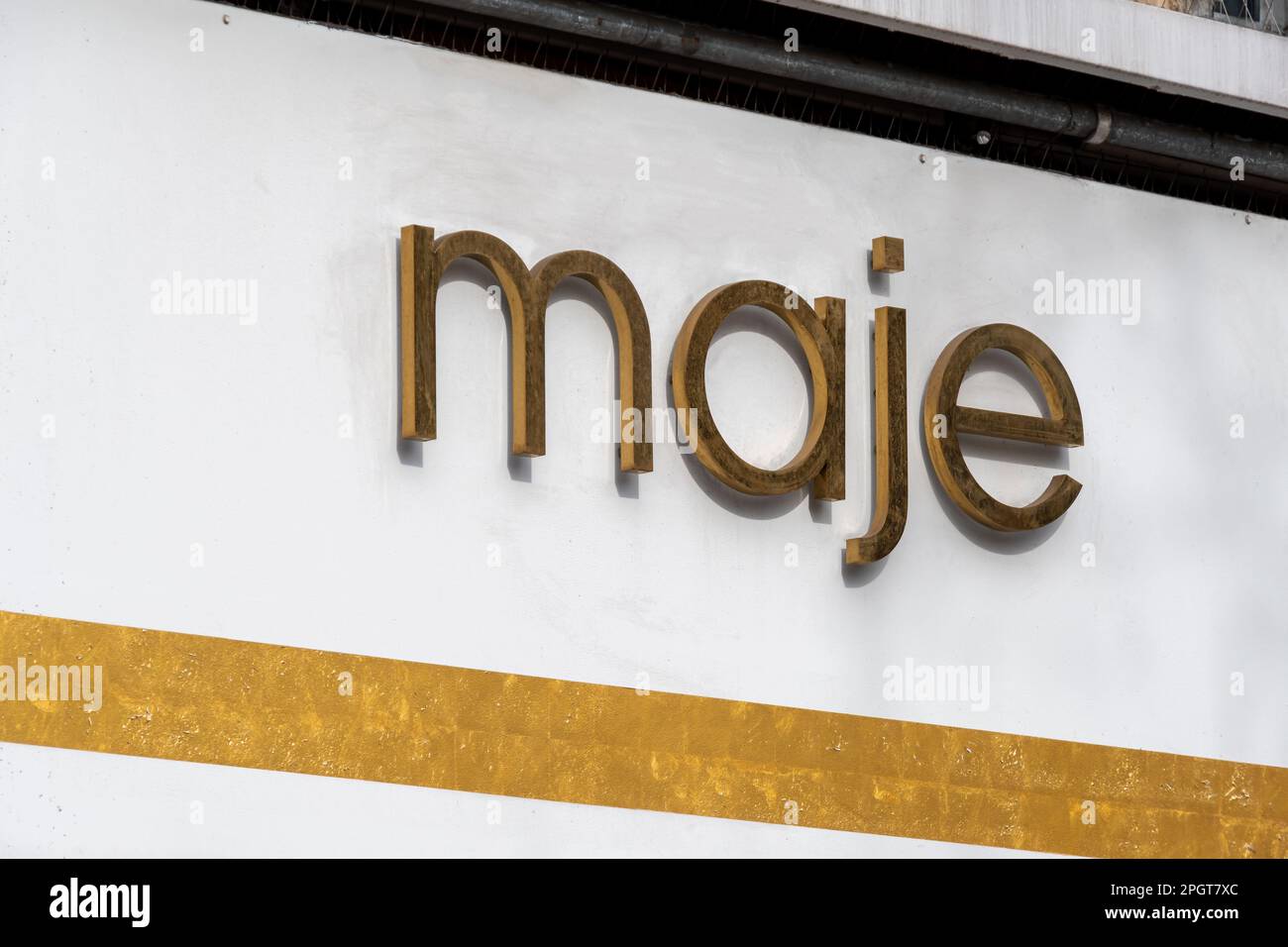 Commercial sign of a Maje boutique, a French women's ready-to-wear ...