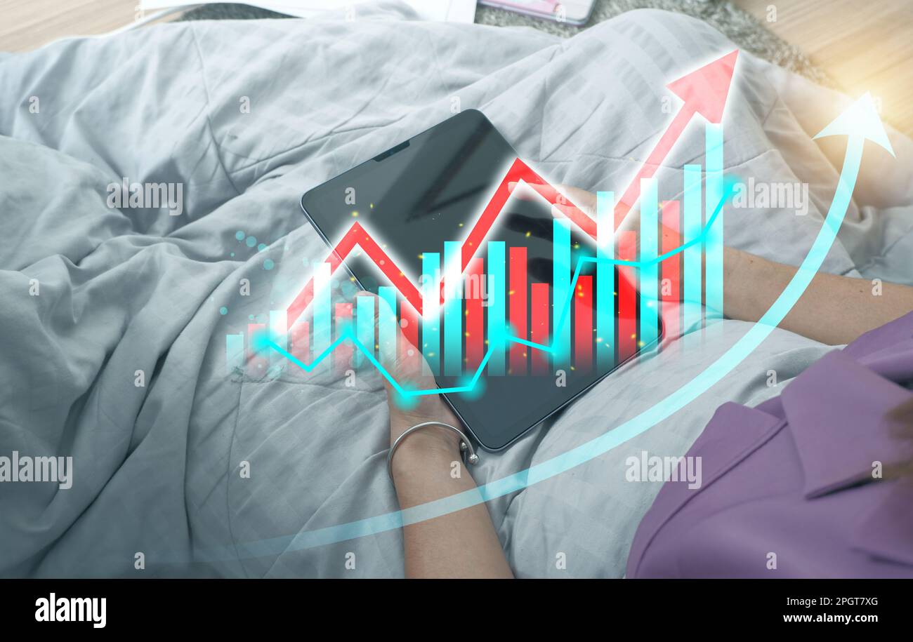 business growth plan with virtual hologram chart Calculate earnings and ...