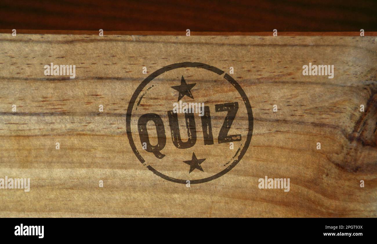 Quiz stamp printed on wooden box. Competition question and answer ...