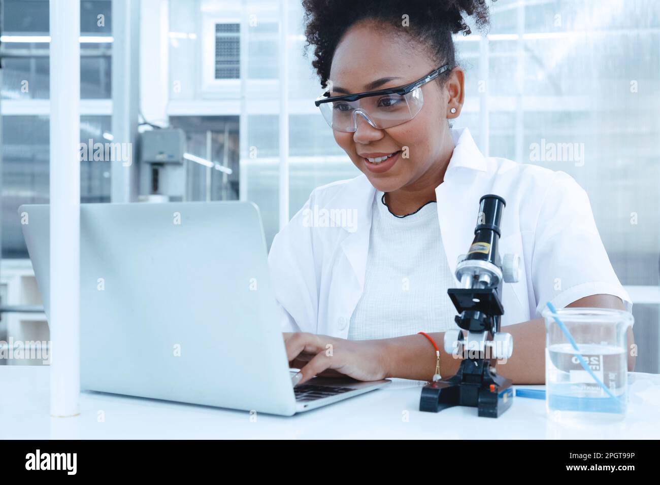 smiling black scientist doctor student studying and experiment analysis ...