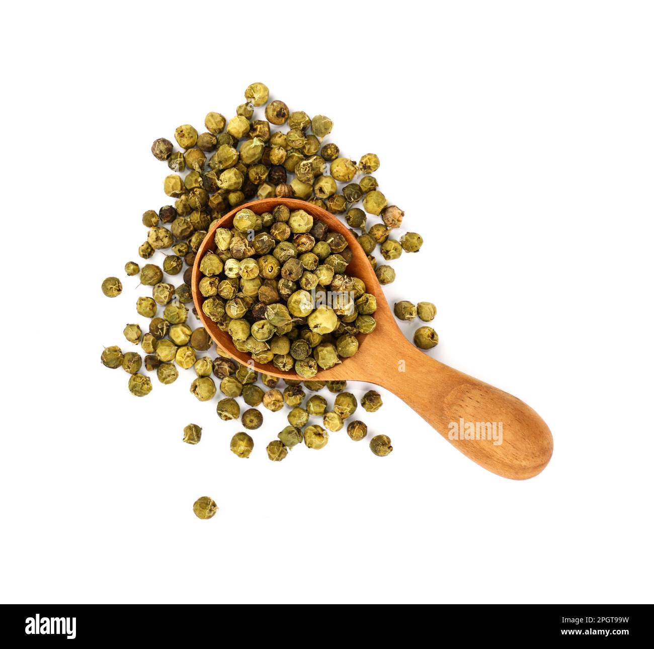 Close up one wooden scoop spoon full of green pepper peppercorns and ...