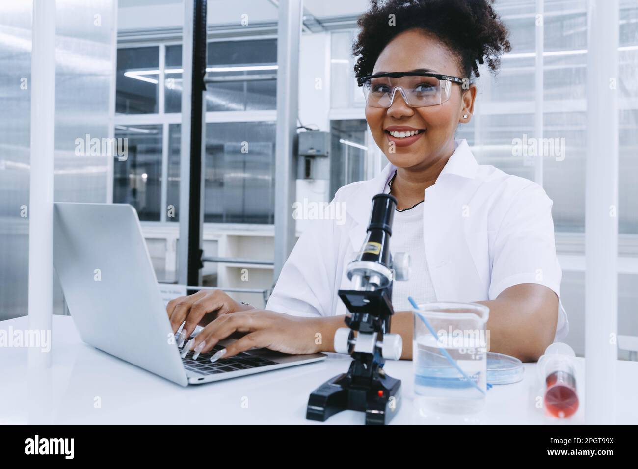 smiling black scientist doctor student studying and experiment analysis ...