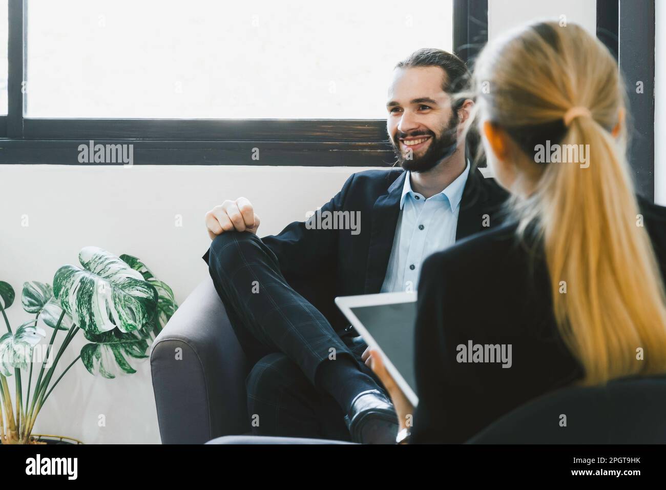 Young man interview smiling hi-res stock photography and images - Alamy