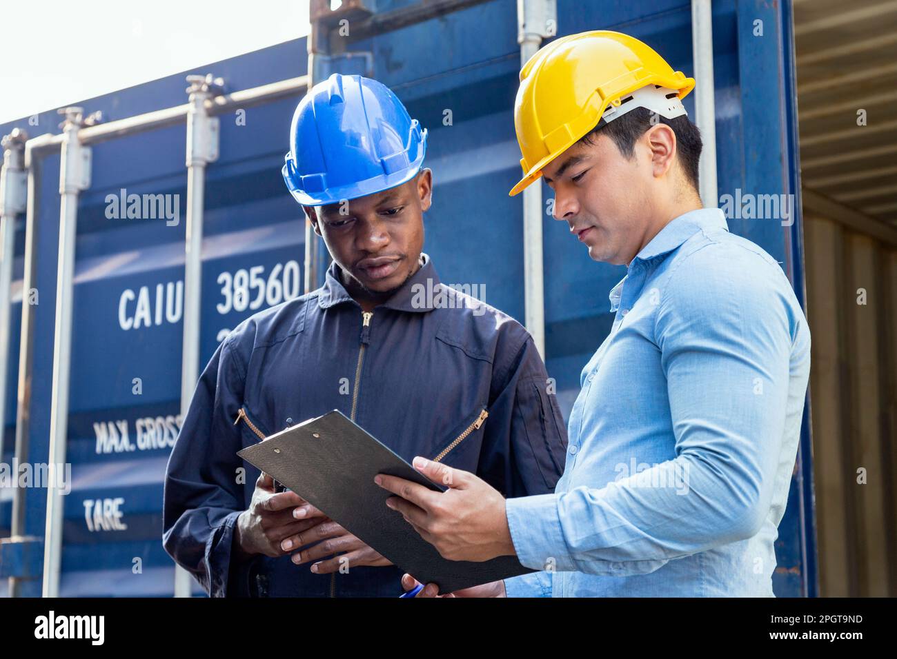 Warehouse business manager and port worker working and checking ...