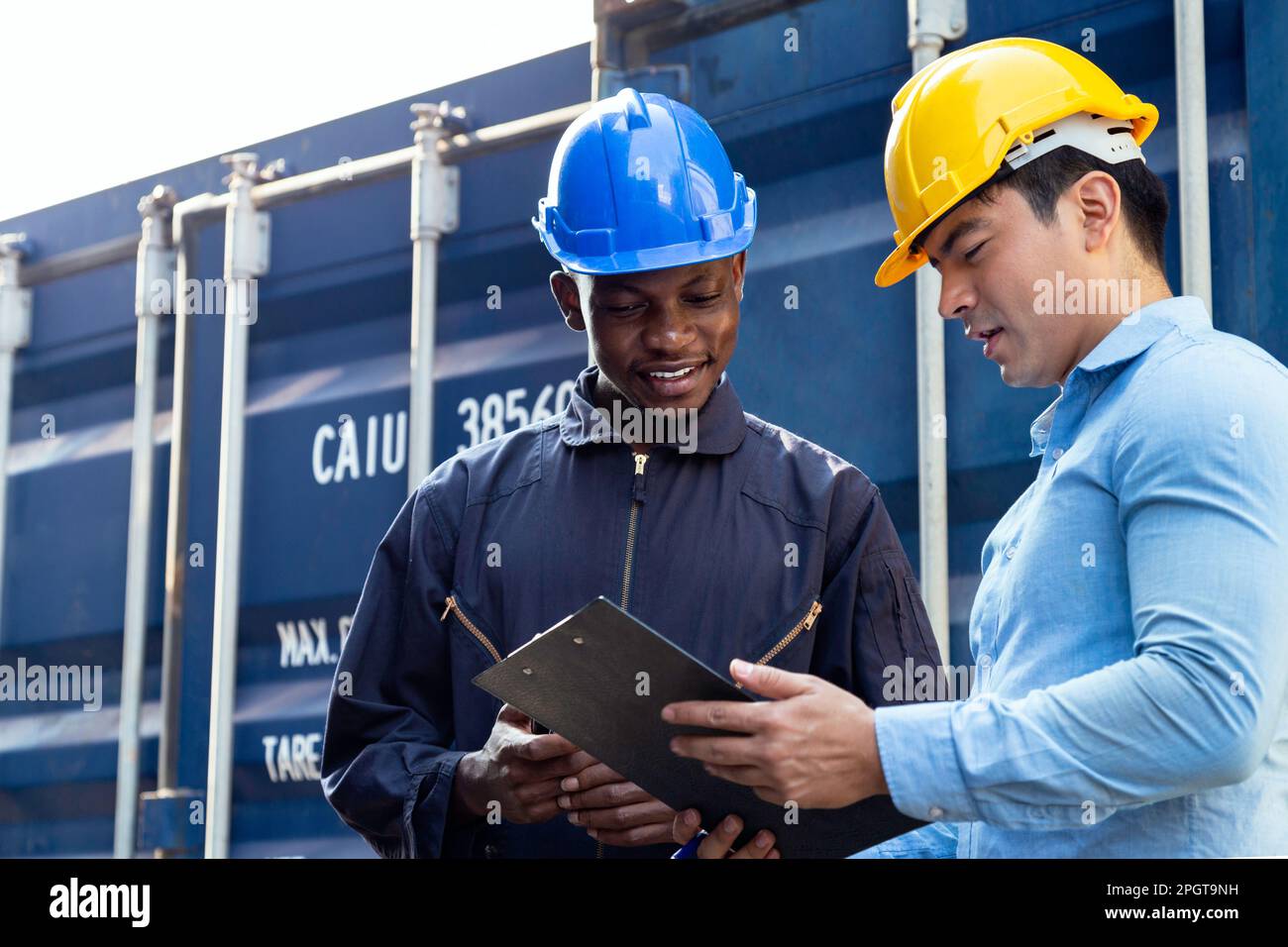Warehouse business manager and port worker working and checking ...