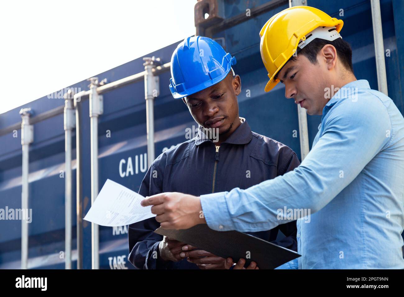 Warehouse business manager and port worker working and checking ...
