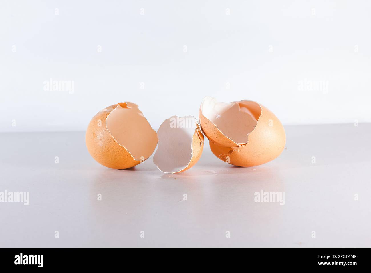 Broken egg isolated on white background, broken egg shell from impact Stock Photo - Alamy