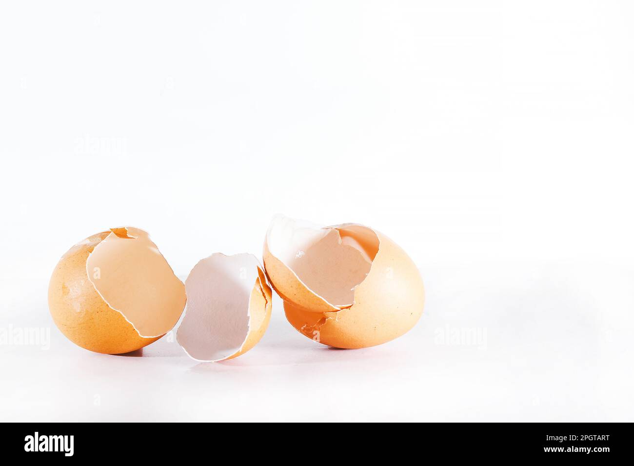 Broken egg isolated on white background, broken egg shell from impact Stock Photo - Alamy
