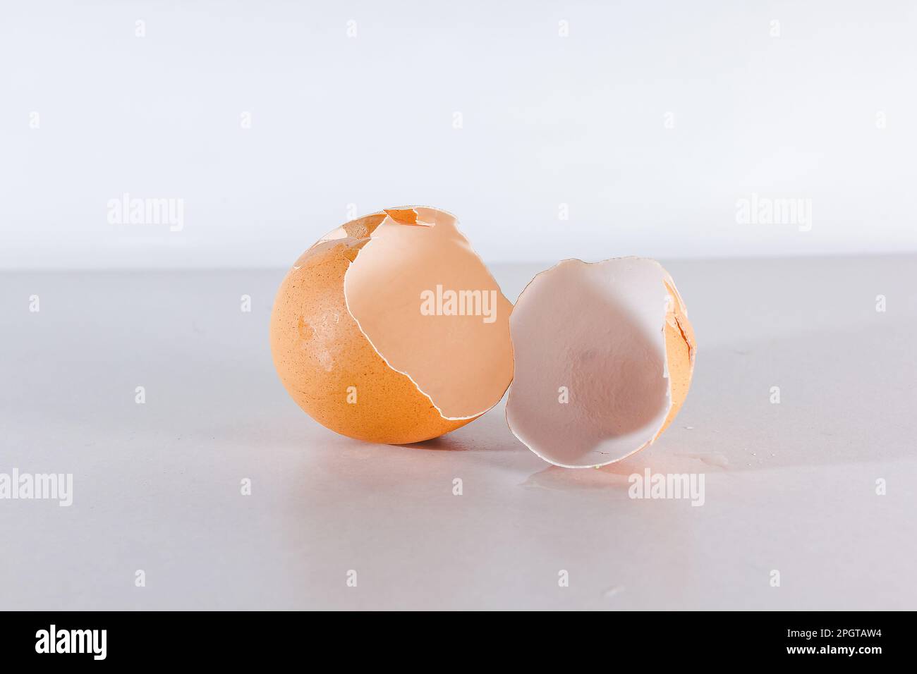 Broken egg isolated on white background, broken egg shell from impact ...