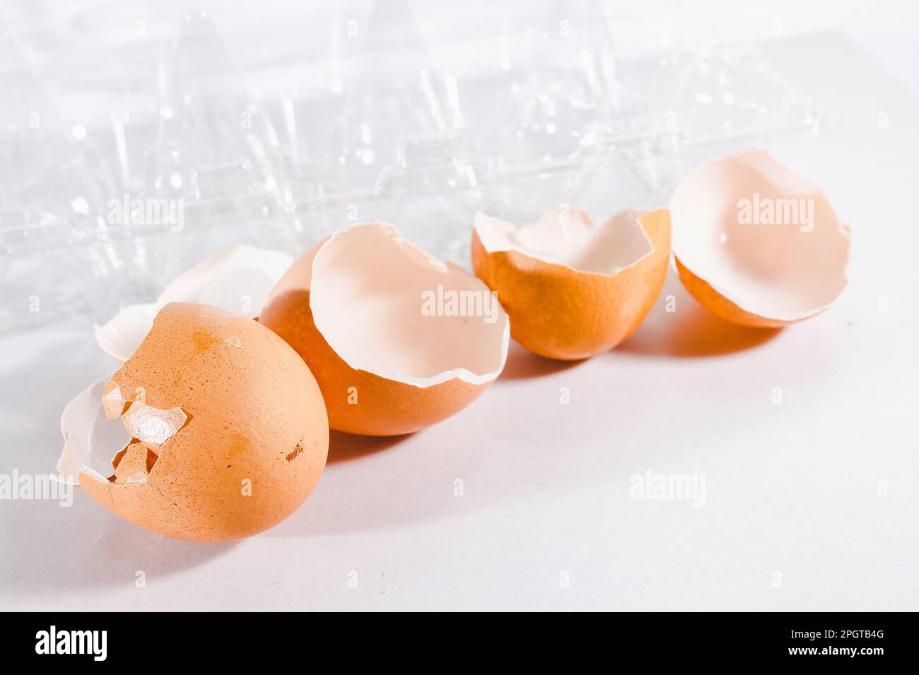 Broken egg isolated on white background, broken egg shell from impact Stock Photo - Alamy