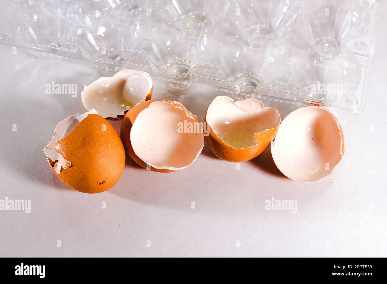 Broken egg isolated on white background, broken egg shell from impact ...