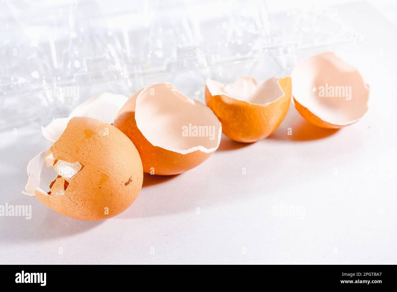 Broken egg isolated on white background, broken egg shell from impact ...