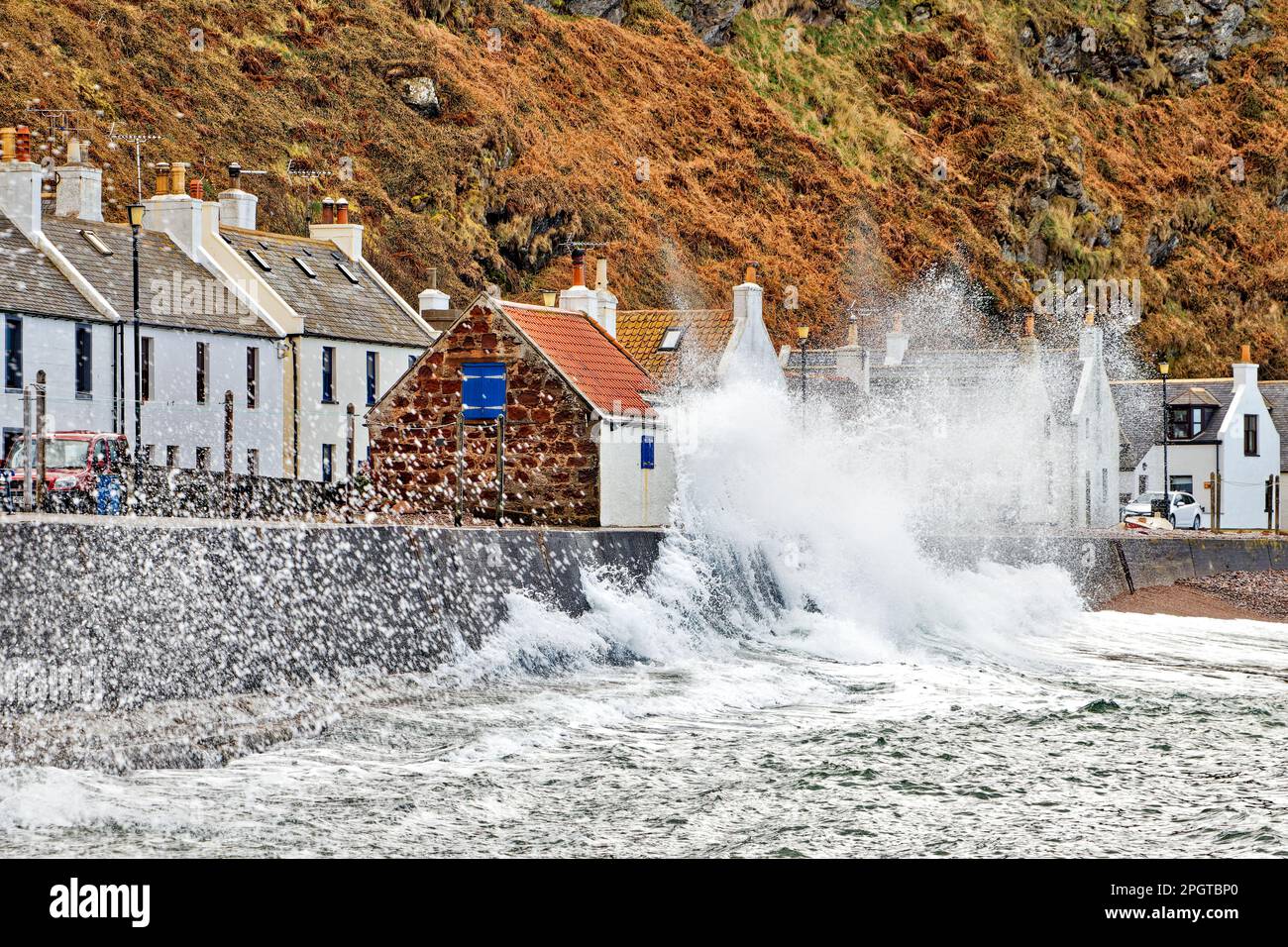 Pennan Aberdeenshire Scotland high tide a large wave breaking over the ...