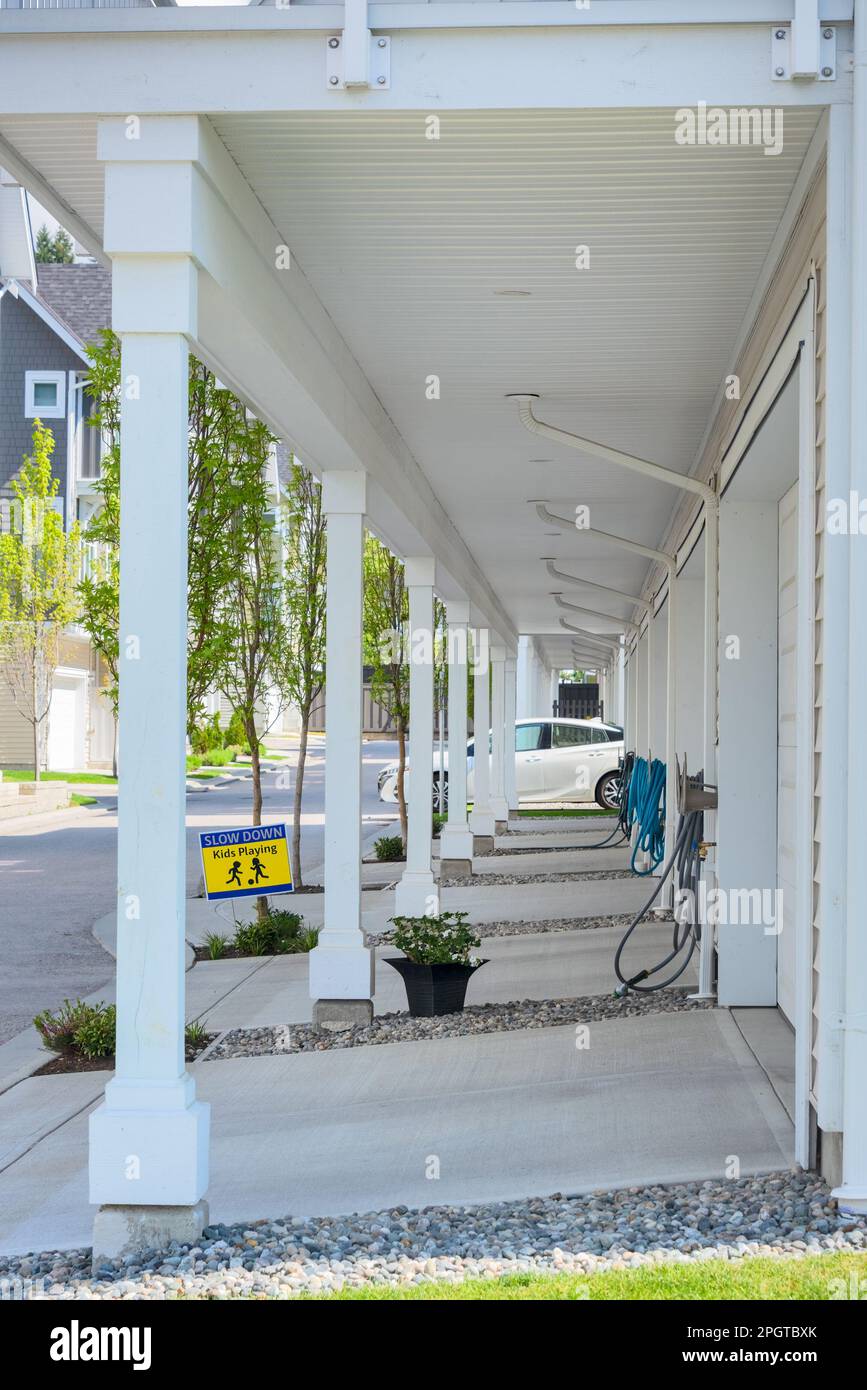 Back road and townhouse driveways in residential community Stock Photo ...