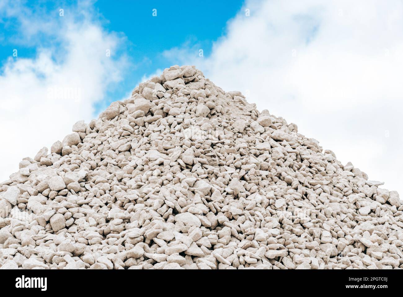 Sorted limestone rock in embankment. Open pit mining quarry. Geology ...