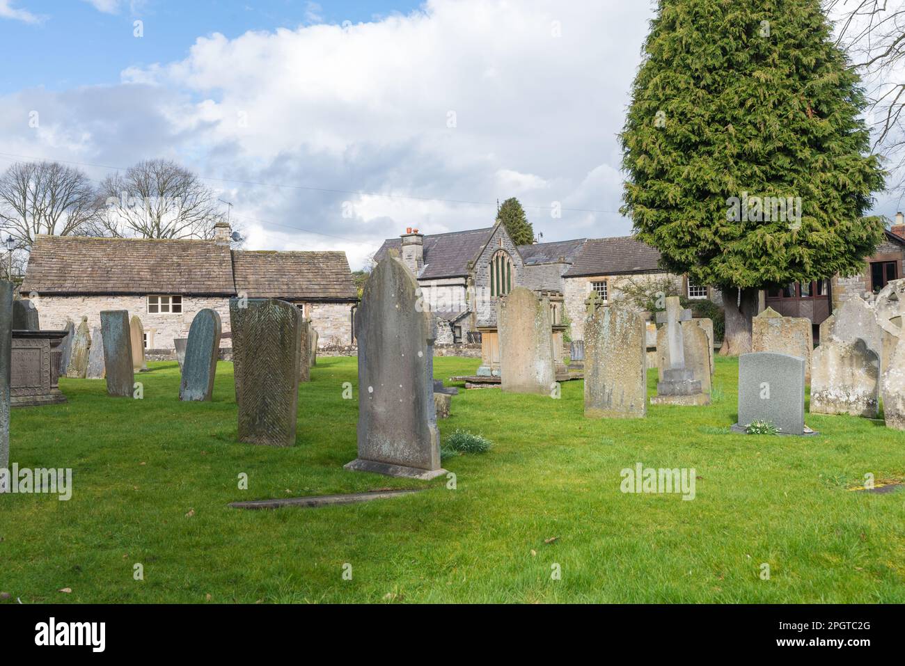 Holy Trinity Church and graveyard in the pretty Derbyshire village of ...