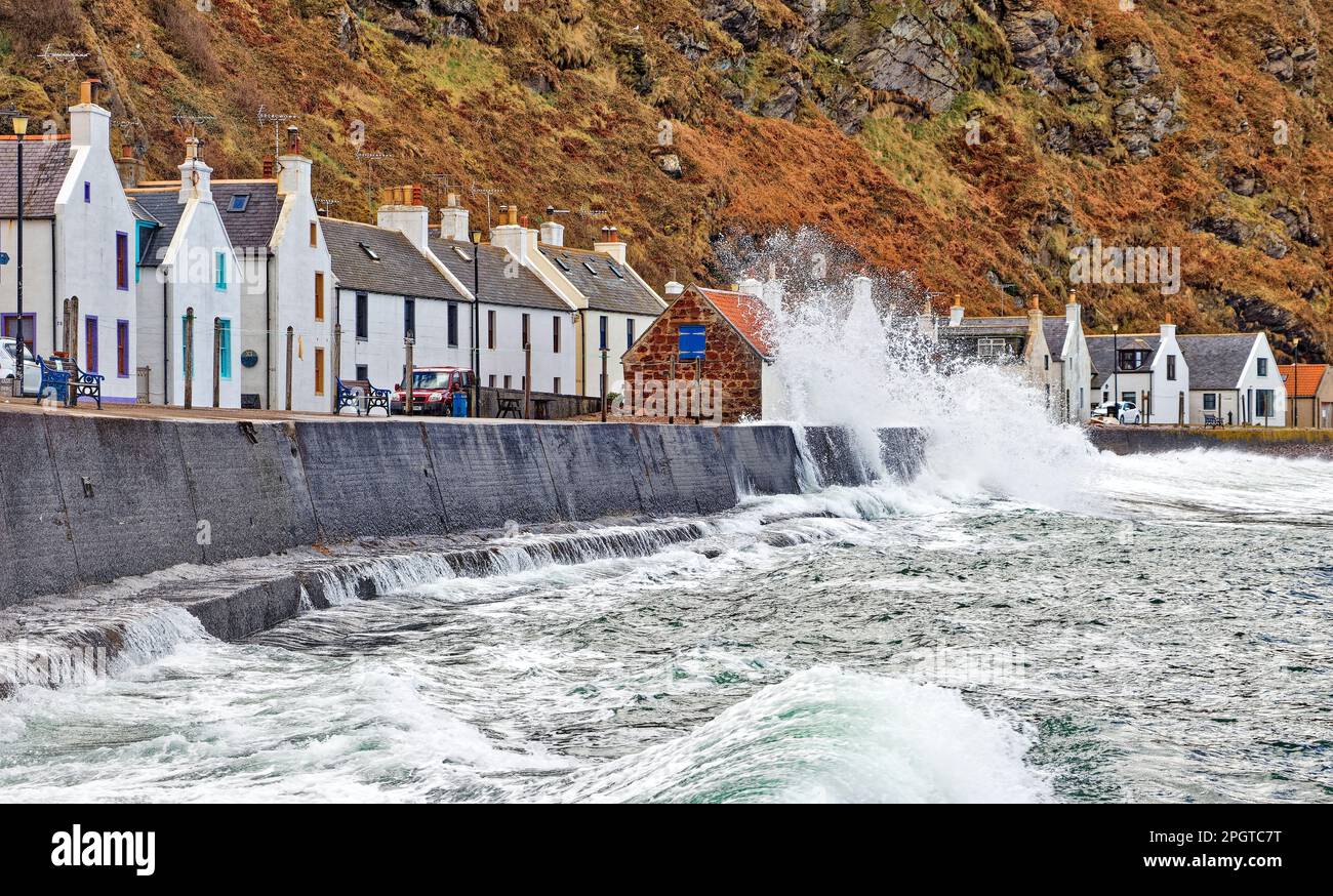 Pennan village Aberdeenshire Scotland a very high tide and a large ...