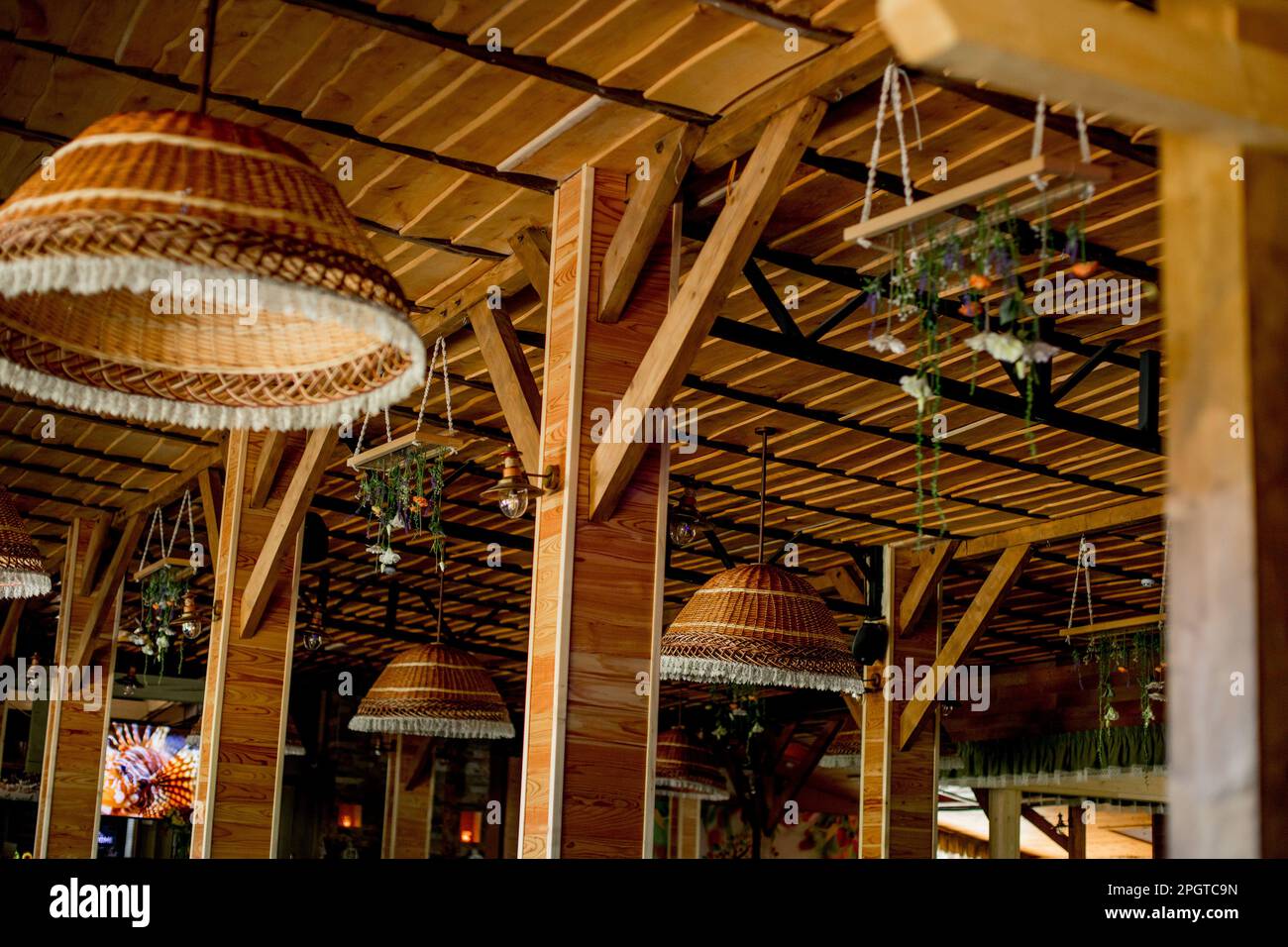 Wicker straw lamps, wooden roof. Trendy interior design of a hipster ...