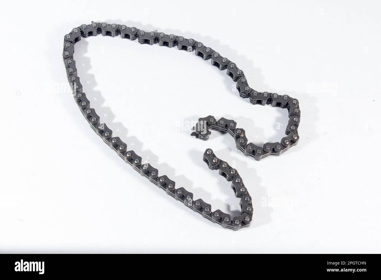 Old chains inside the motorcycle engine on a white background ...