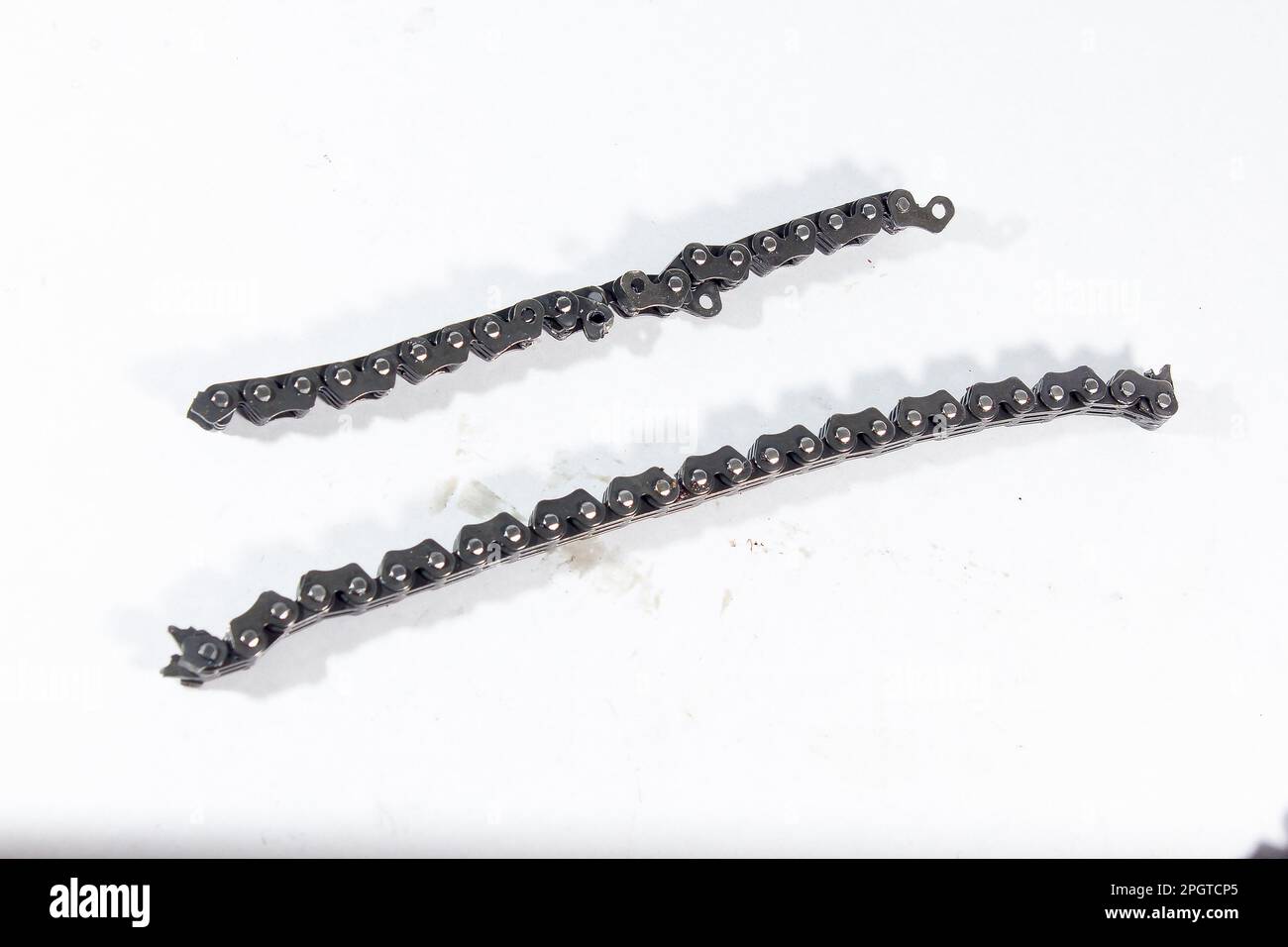 Old chains inside the motorcycle engine on a white background ...