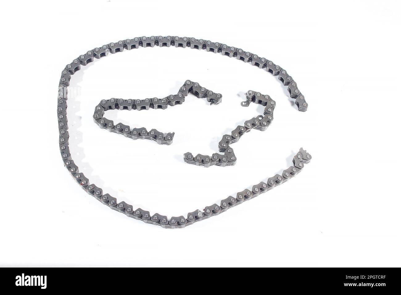Old chains inside the motorcycle engine on a white background ...