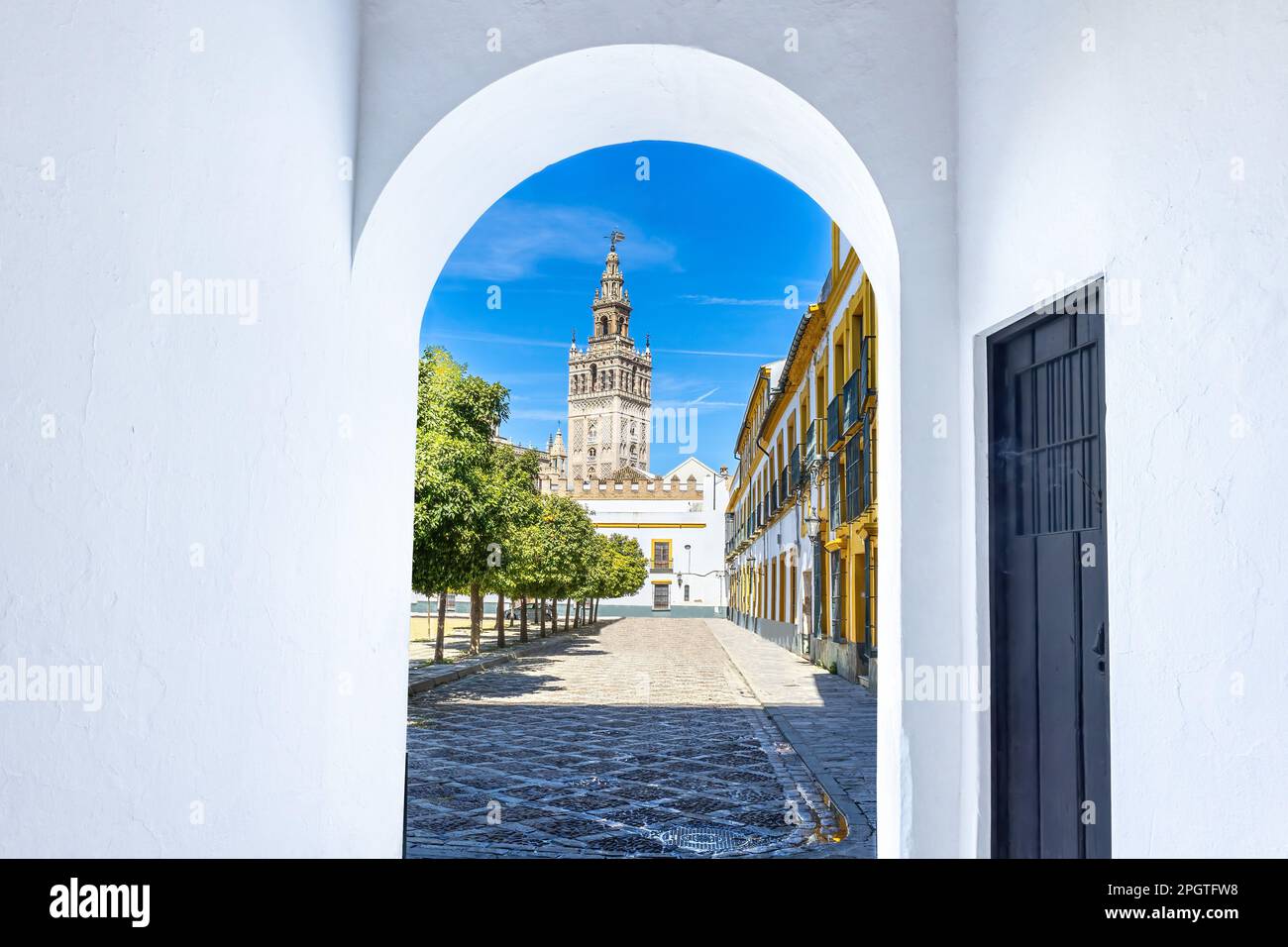 View of tower bell of Seville Cathedral from Santa Cruz neighborhood ...