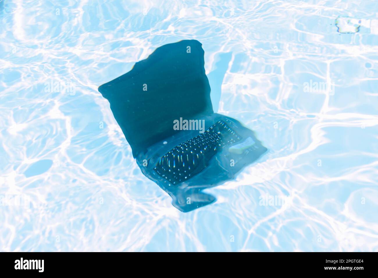 laptop thrown under trasparent water in a swimming pool Stock Photo - Alamy