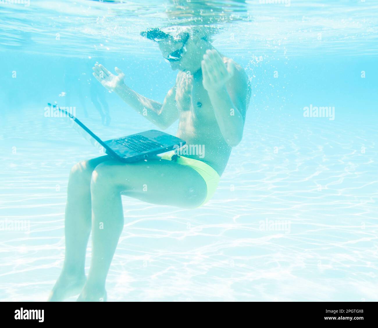 Man working sitting swimming pool hi-res stock photography and images ...