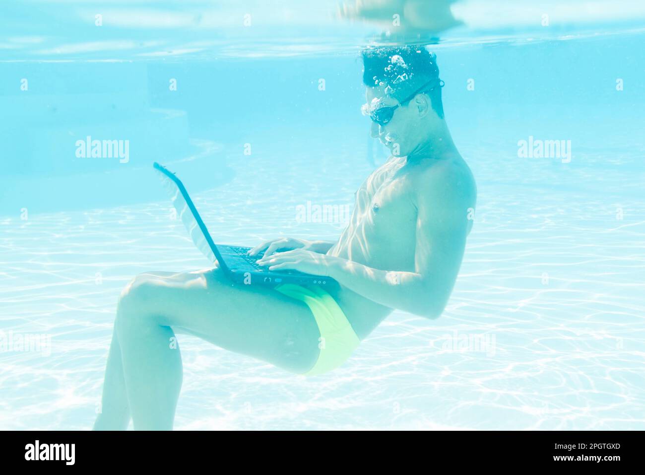Man working sitting swimming pool hi-res stock photography and images ...
