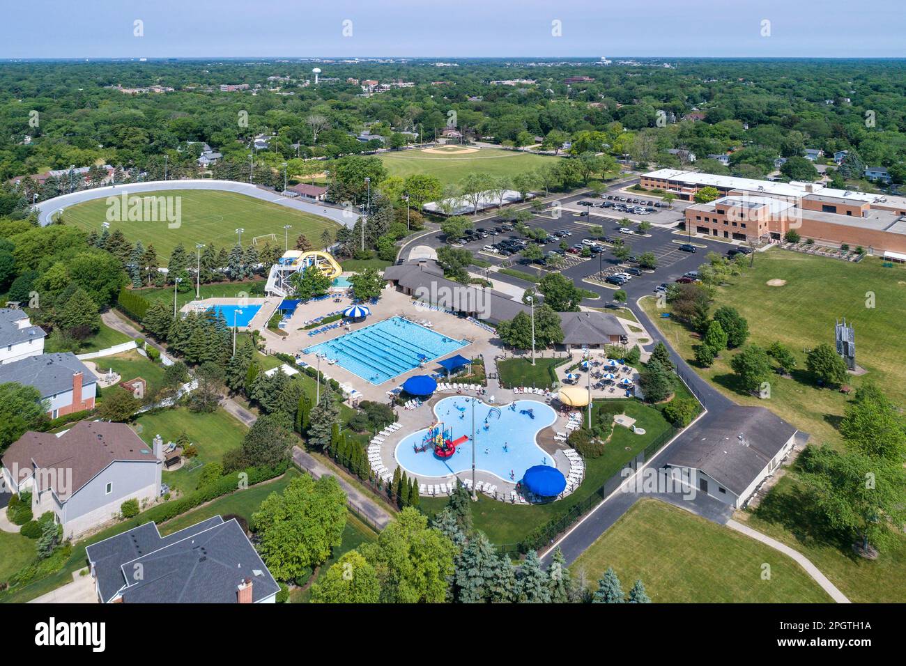 Aerial view of a large park with a junior high school, baseball diamond ...