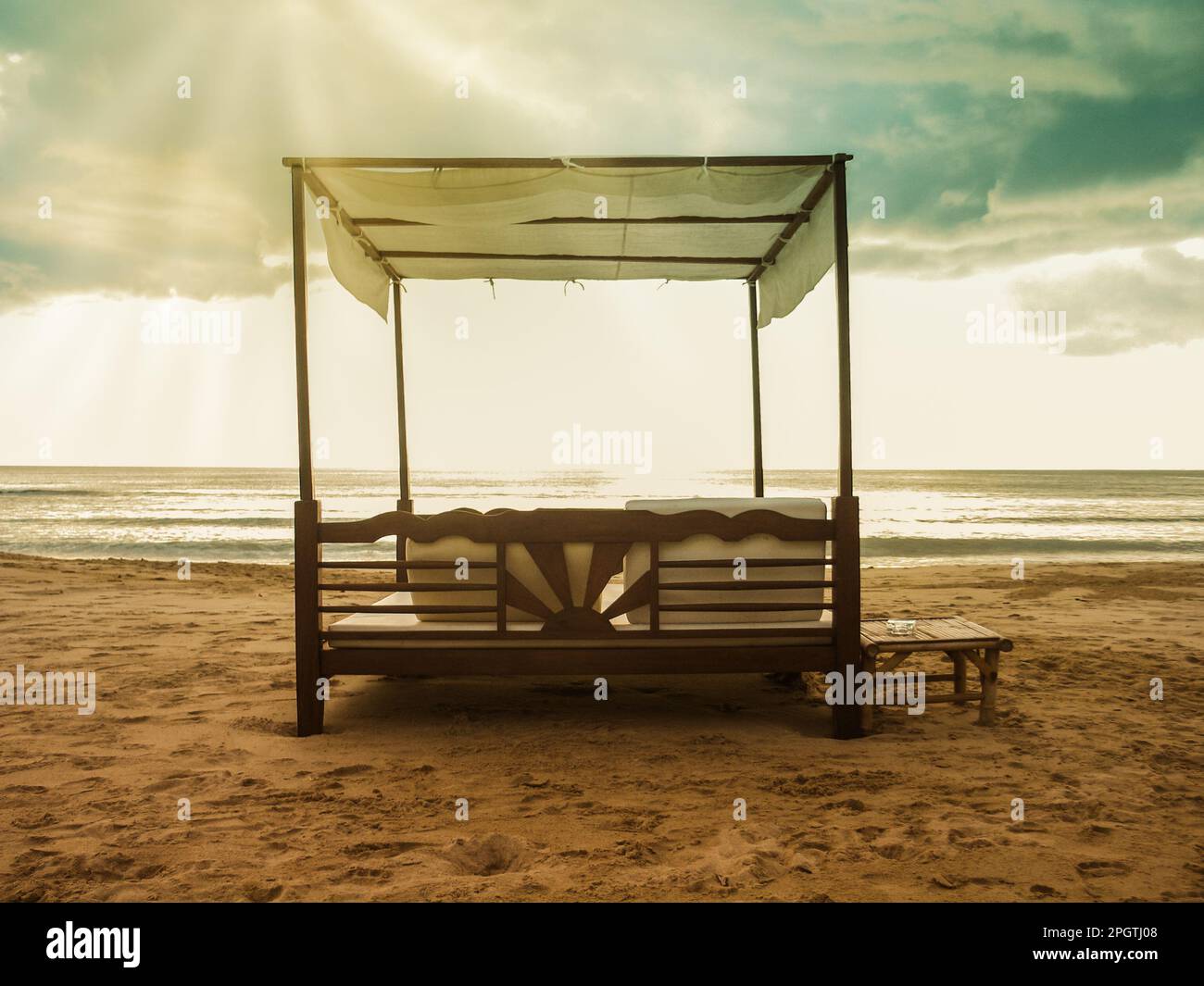 Four poster bed on beach by the sea Stock Photo - Alamy