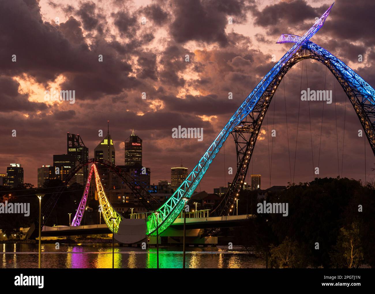 A stunning view of the Matagarup bridge lit up with a rainbow of ...